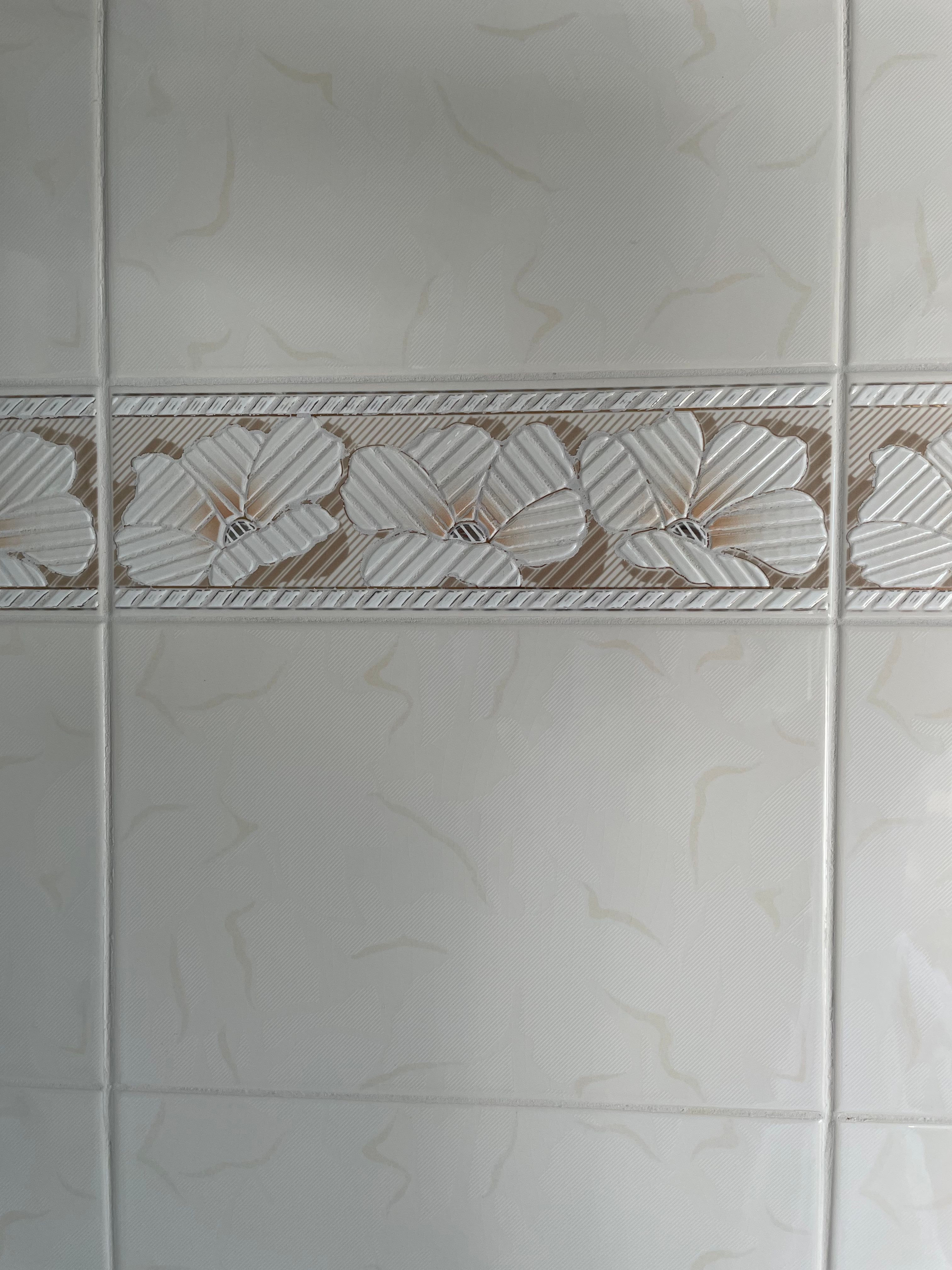 How to cover tiles with raised designs? | Bunnings Workshop community